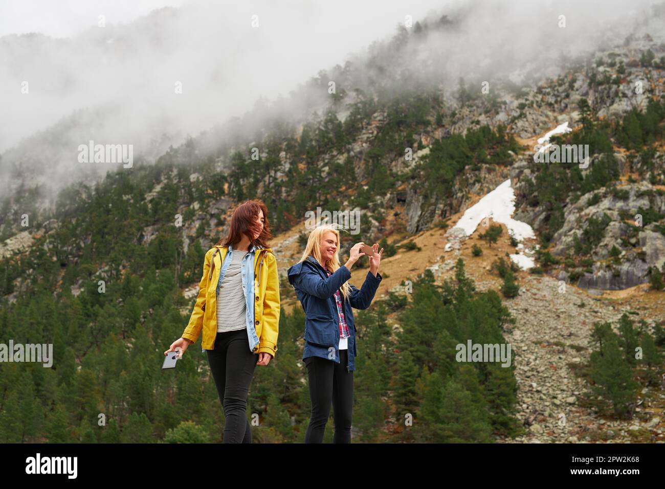 Shot of two friends having fun outside Stock Photo - Alamy