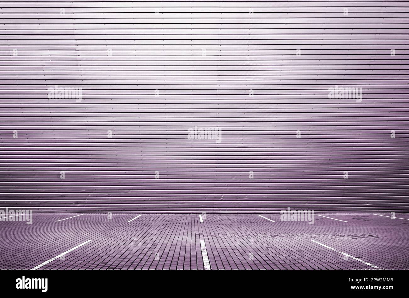 Empty parking spaces on the background of a metal wall with plenty of ...