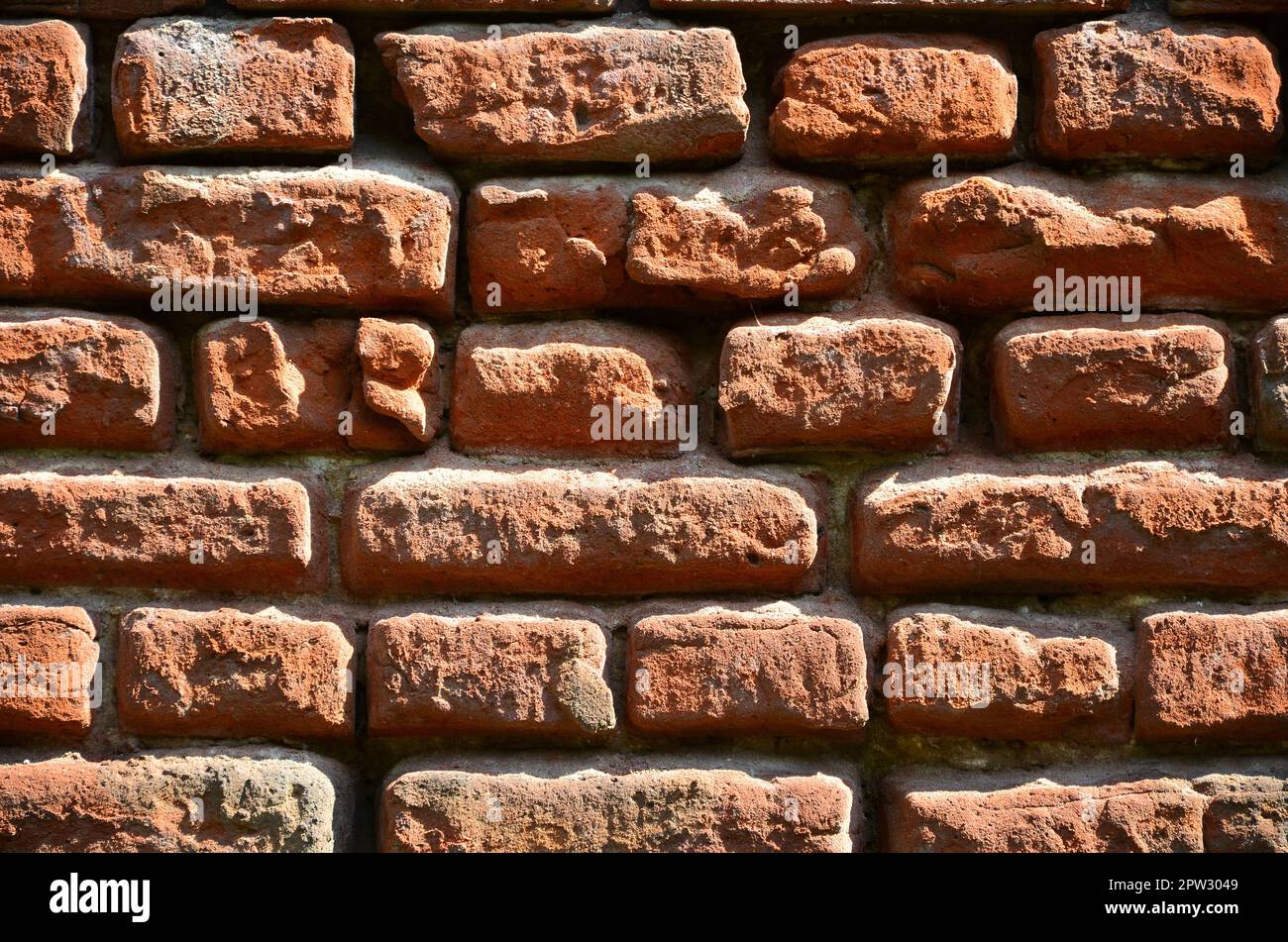 Horizontal wall texture of several rows of very old brickwork made of ...