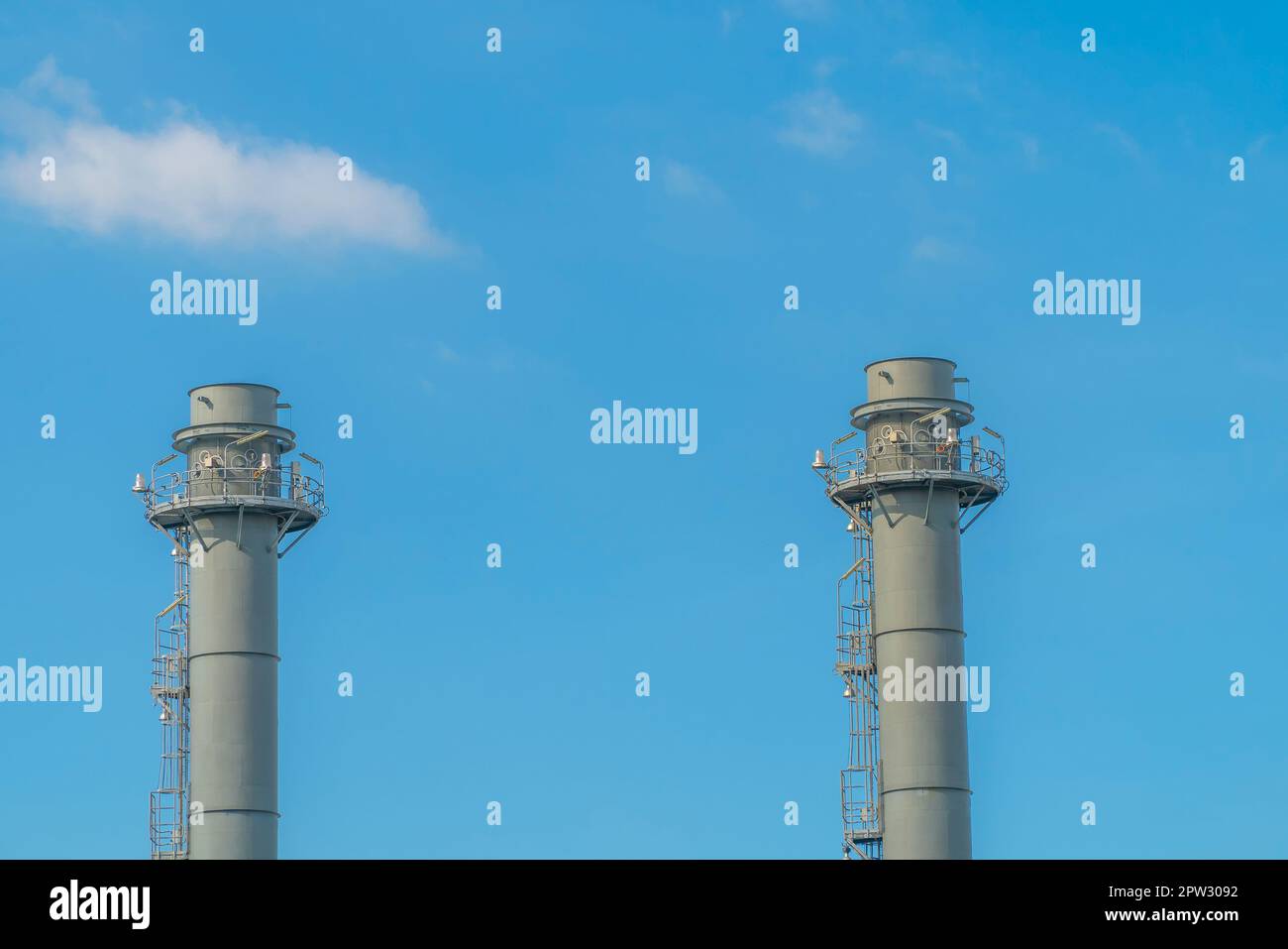 Industrial chimney of power plant and oil refinery Stock Photo - Alamy