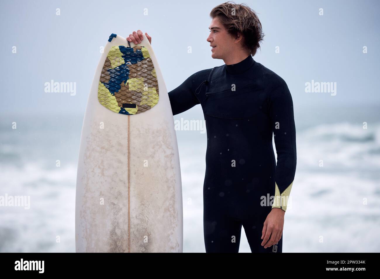 Beach, athlete and man with a surfboard on a vacation, summer adventure ...
