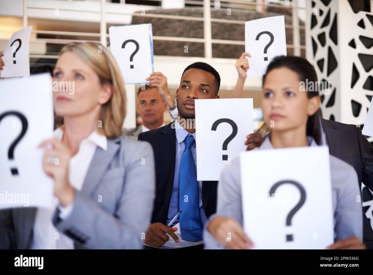 Business team holding question marks hi-res stock photography and ...