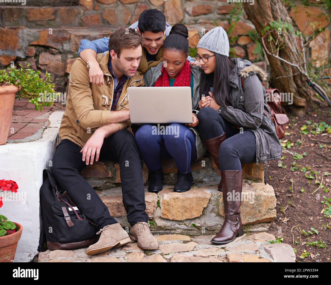 Revising for their upcoming test. a university students using a laptop ...