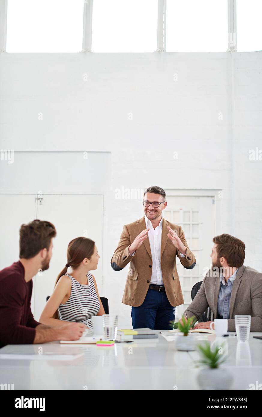 Theyre idea people. a businessman giving a presentation to colleagues ...