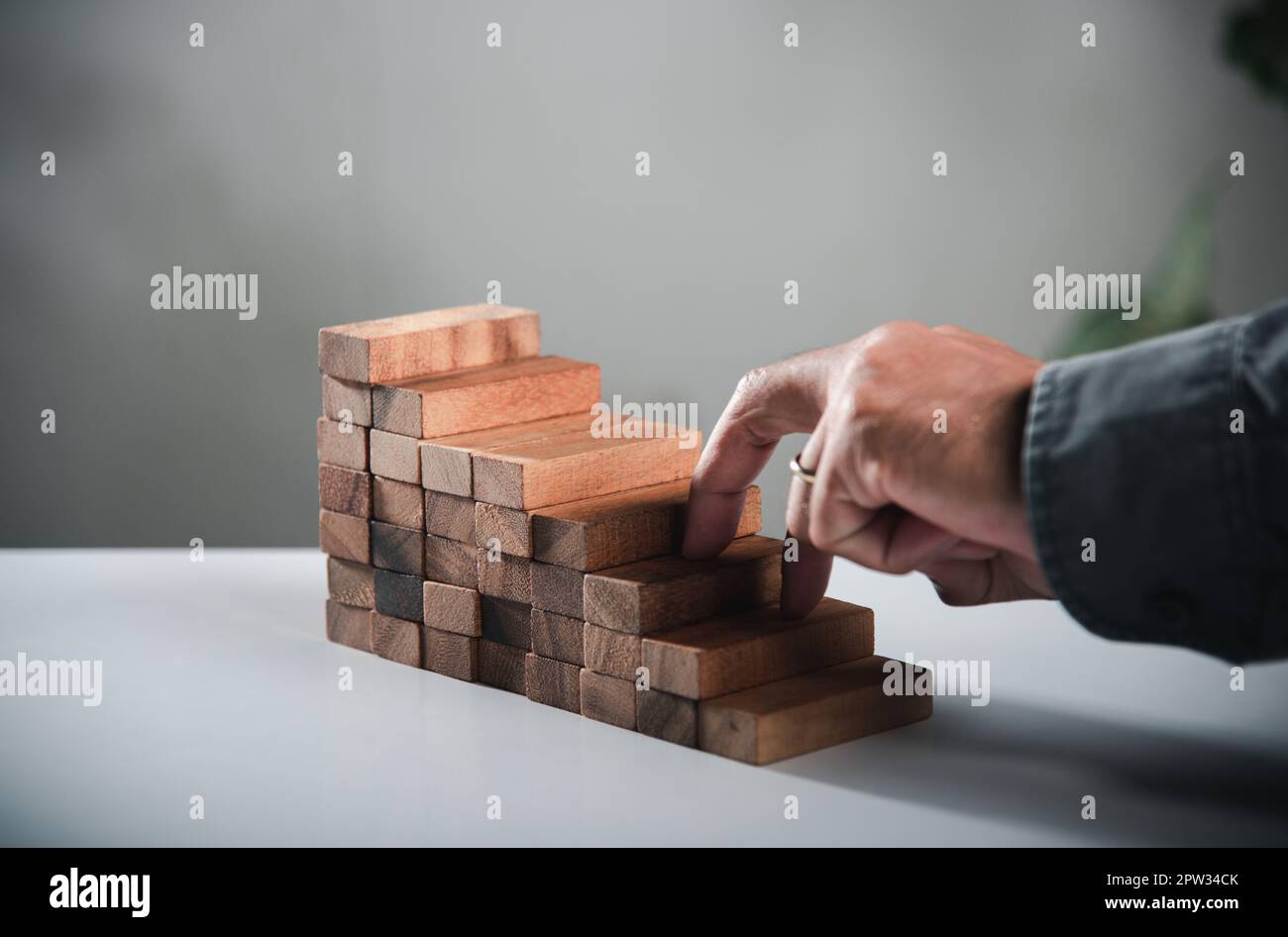 Business two finger symbol walking up on wood blocks shape staircase to ...