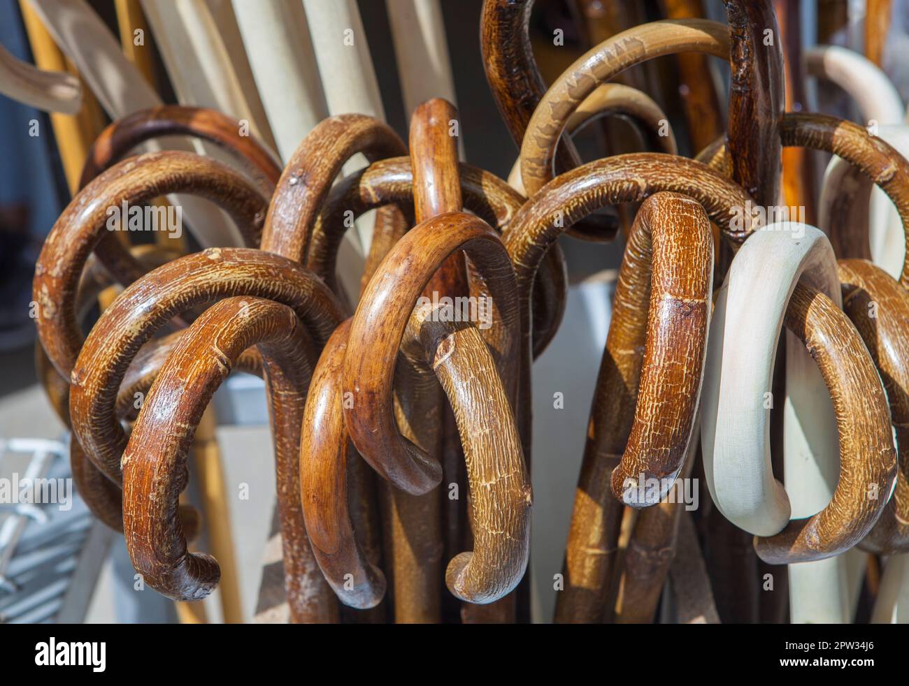 Walking sticks displayed at traditional market stall. Selective focus ...