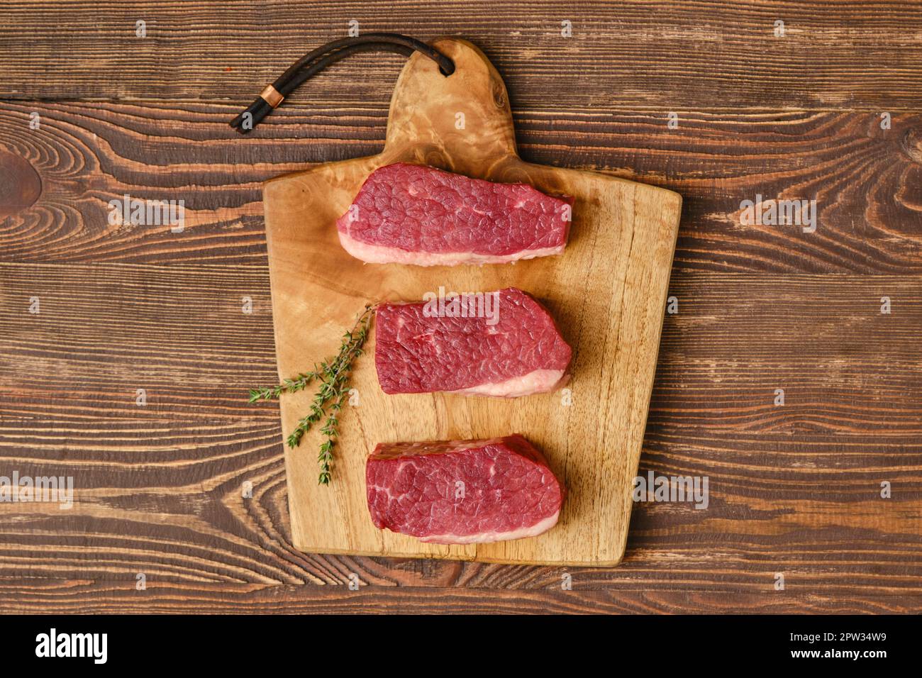 Top view of raw fresh eye of round steak on cutting board Stock Photo ...