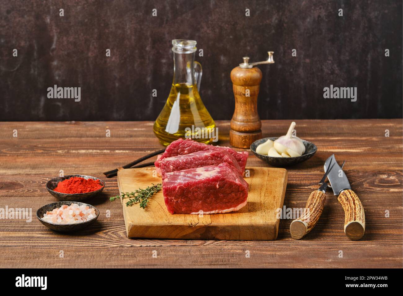 Raw beef brisket flat steak on wooden tabletop ready for cooking Stock ...