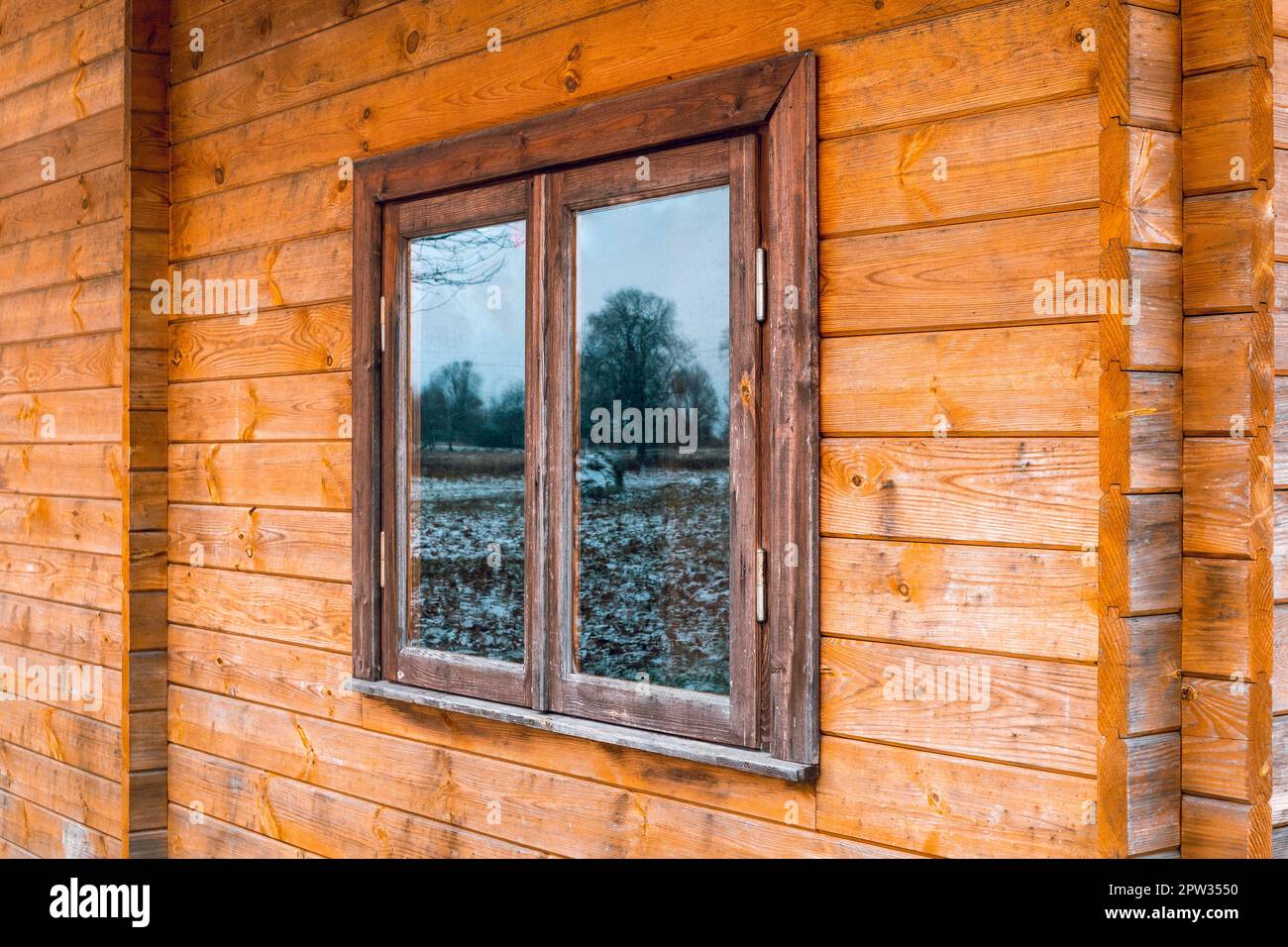 Perspective view to window of an ecological wooden house Stock Photo ...