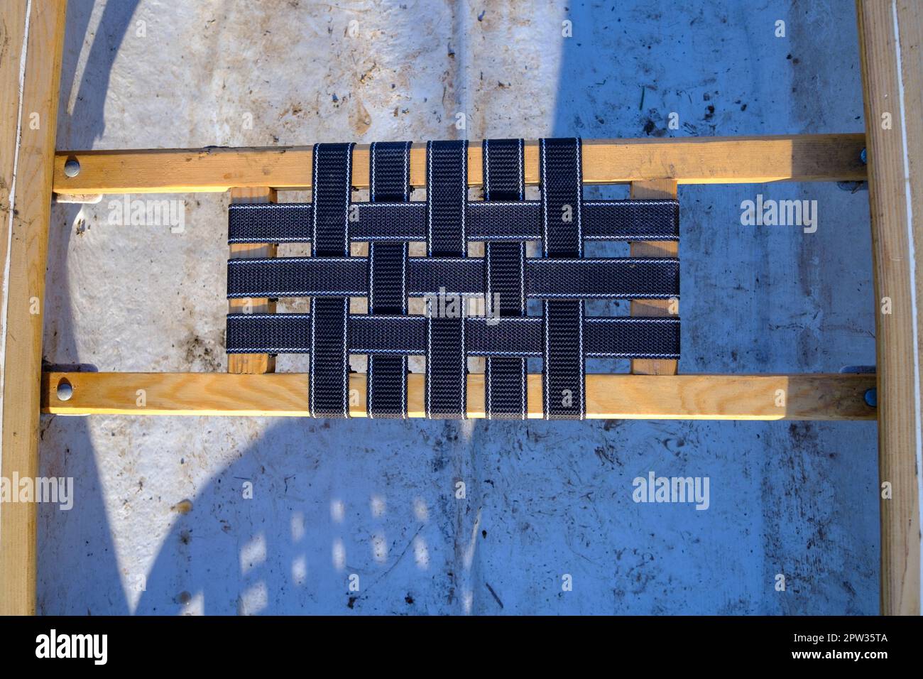 kayak bench. bench woven from fabric ribbons Stock Photo - Alamy