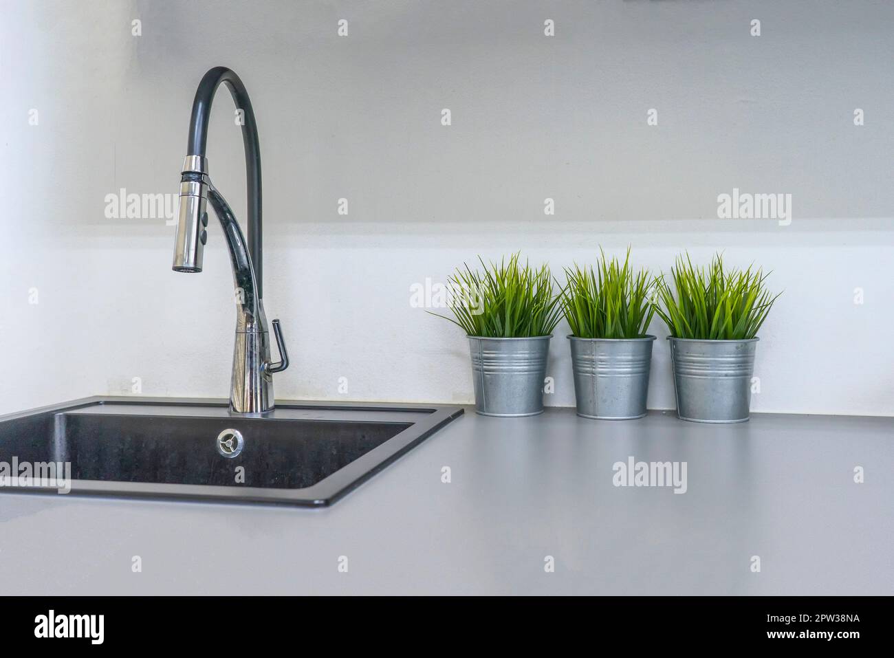 Kitchen sink and faucet in house interior Stock Photo - Alamy