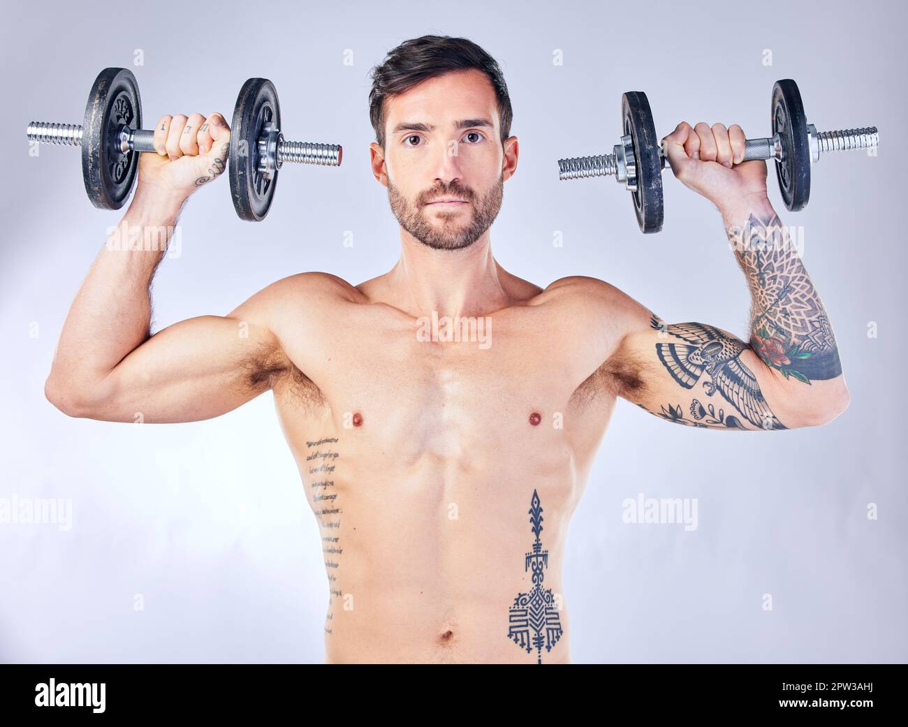 Portrait, exercise and man with weights for training, fitness and ...