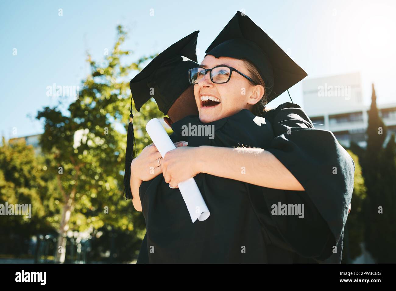 Female students hugging in school hi-res stock photography and images ...