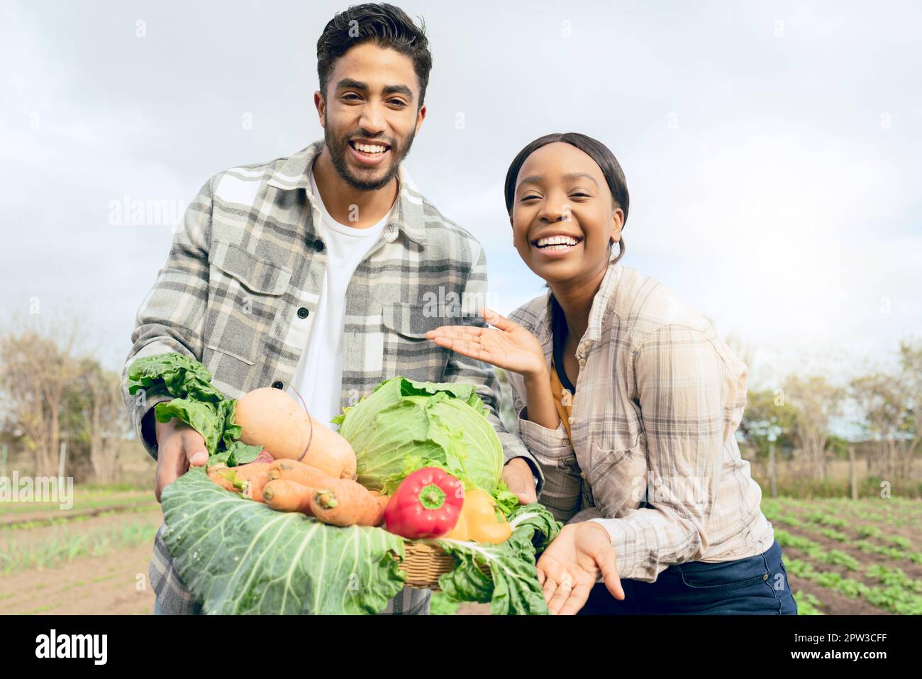 People, farm and portrait of man and woman with vegetable harvest in a ...