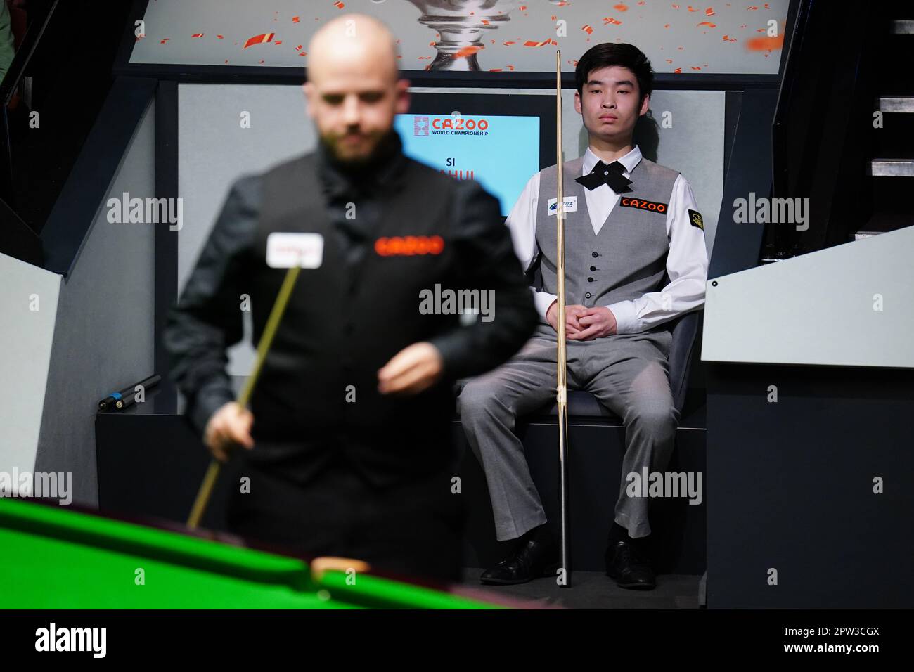 Luca Brecel in action against Si Jiahui (right) on day fourteen of the ...
