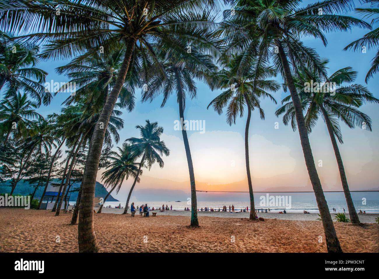Sunset view on beach with people relaxation and orange sunset on Indian ...