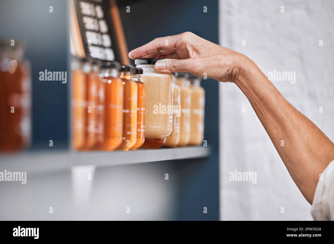 Hand picking glass jar shelf hi-res stock photography and images - Alamy