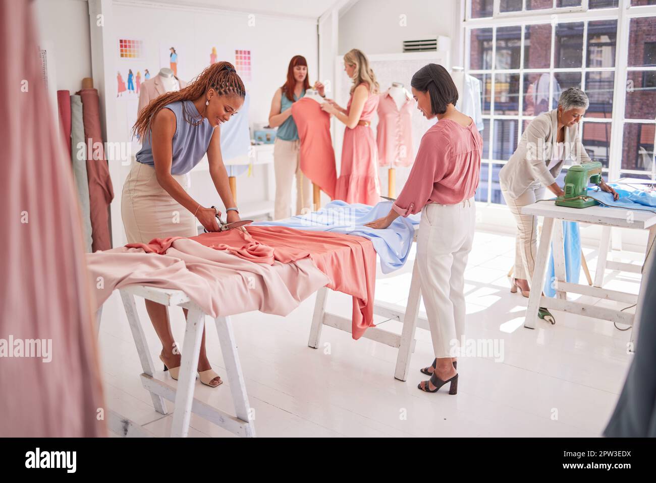 Designer, clothing production and women team working with textile ...