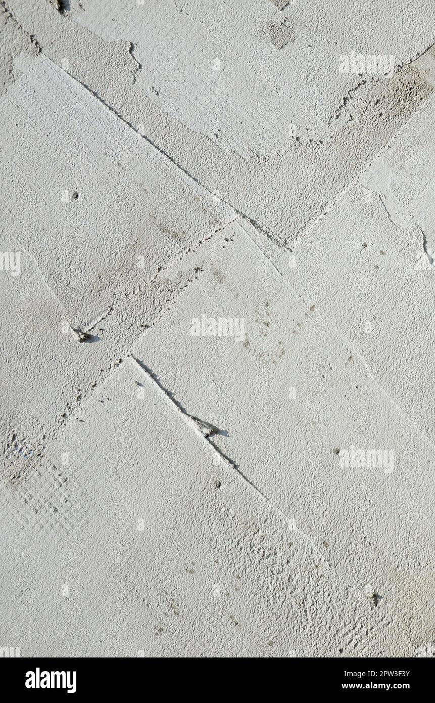 The texture of the wall, covered with gray foam polystyrene plates ...