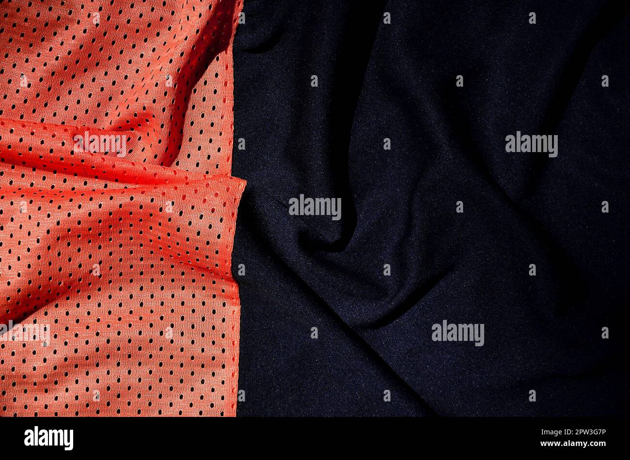 Sport clothing fabric texture background, top view of red cloth textile ...