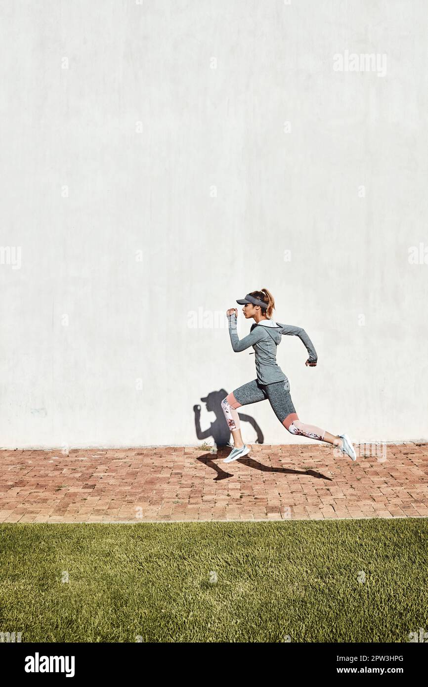 She thrives on exercise. Full length shot of an attractive and athletic ...