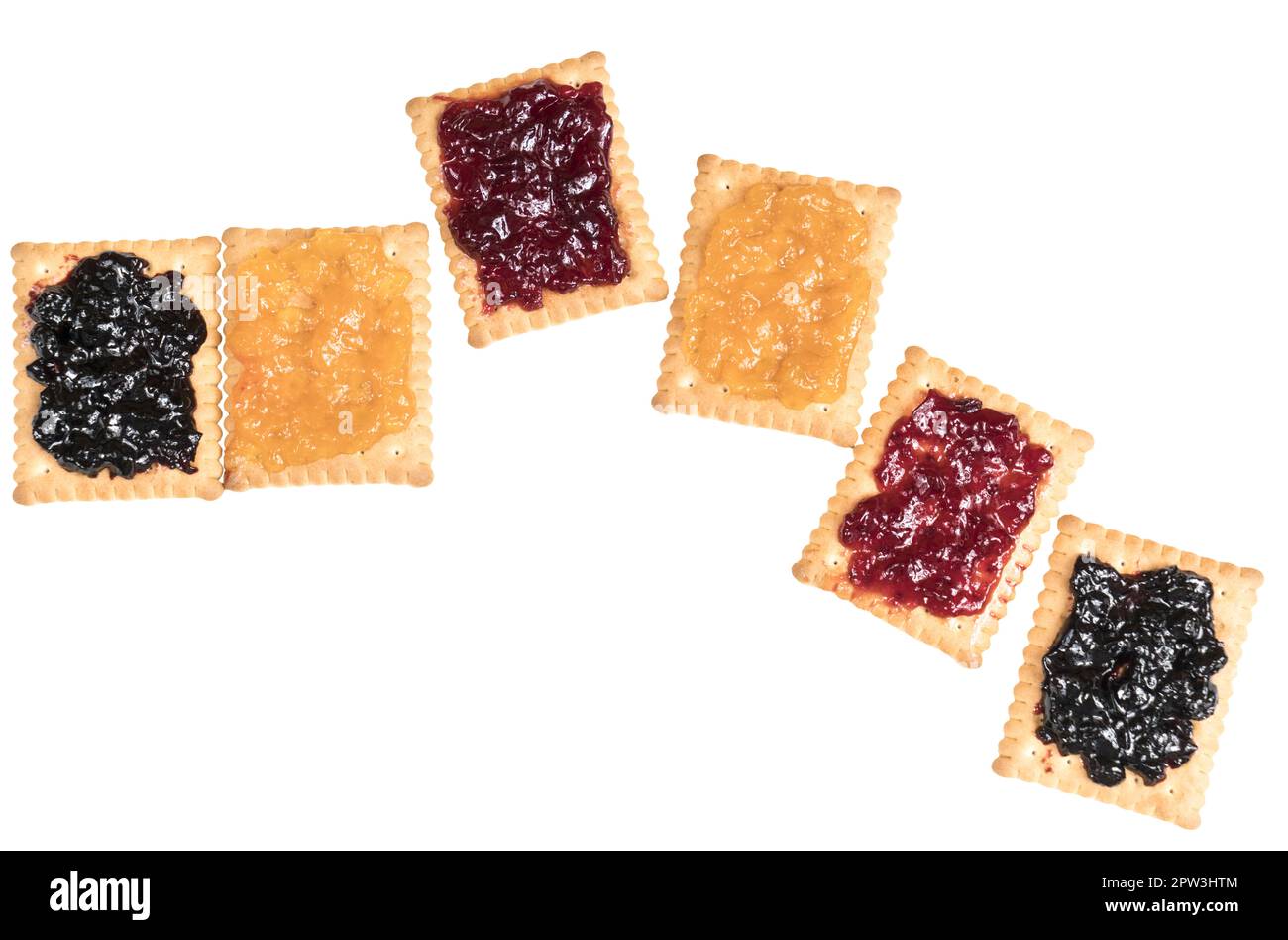 Some dry biscuits with jam on a white surface on a transparent ...