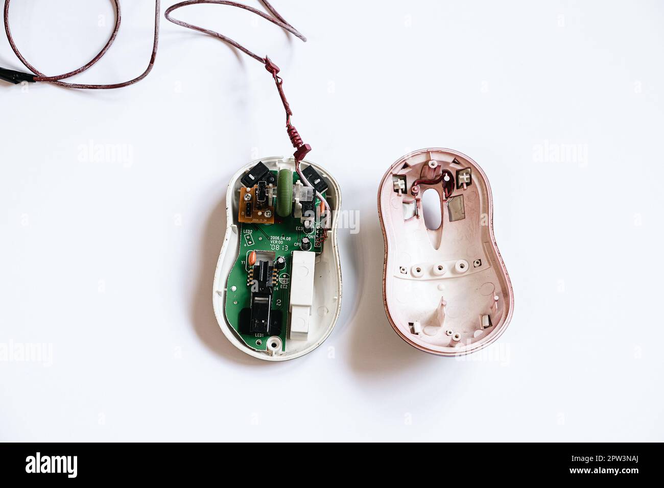 Disassembled computer mouse on white background. Gadget repair ...