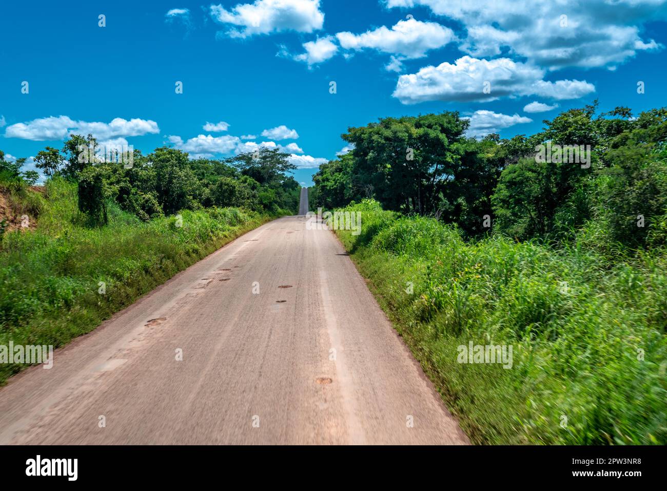 dirt road with potholes in Brazil Stock Photo - Alamy