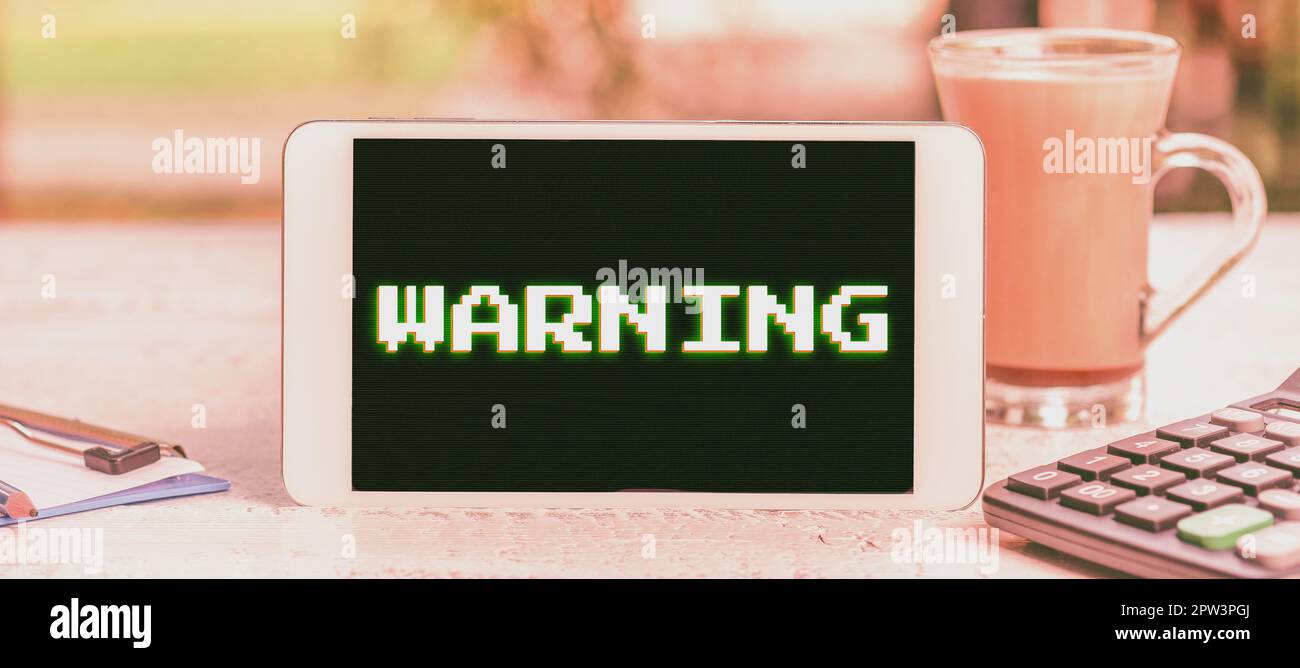 Sign Displaying Warning Word Written On Statement Or Event That Indicates A Possible Or