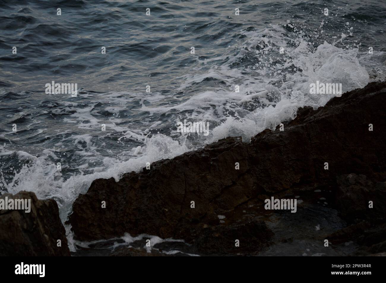 Sea waves crashing into rocks.Sea waves crashing into rocks. Storm at ...