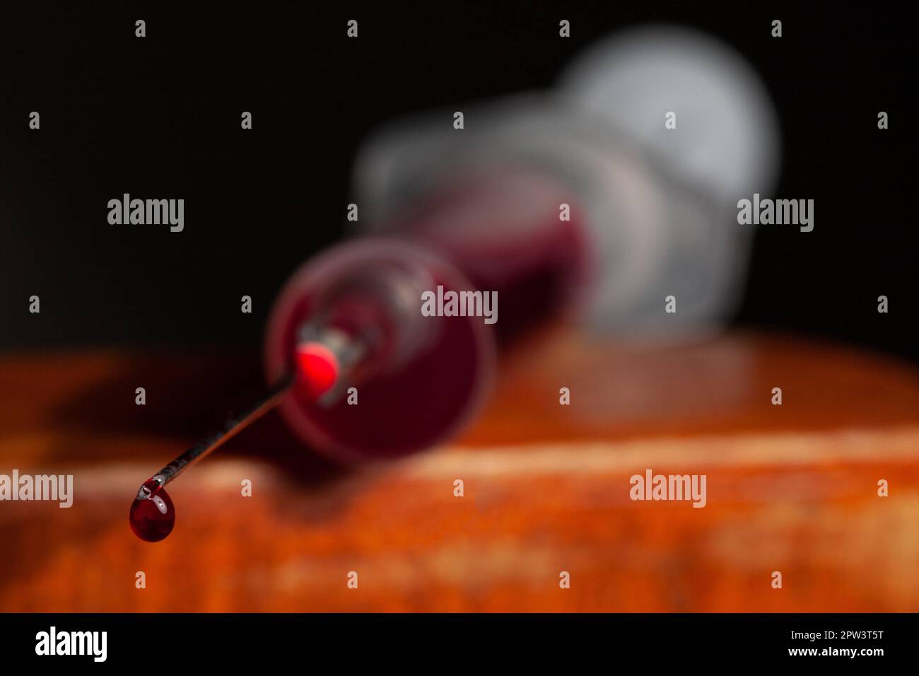 Syringe dripping blood hi-res stock photography and images - Alamy