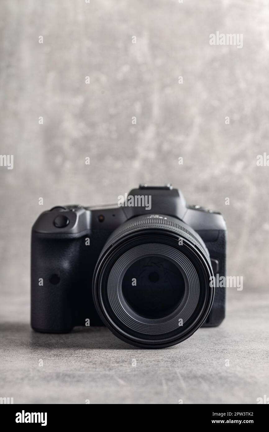 Digital mirrorless camera on the gray table Stock Photo - Alamy