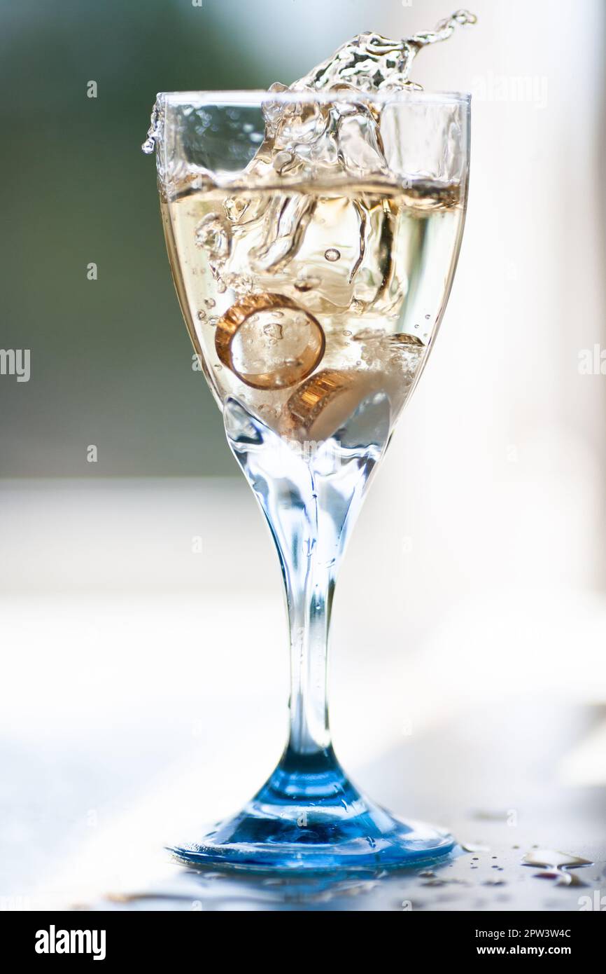 Wedding rings falling glass hi-res stock photography and images - Alamy