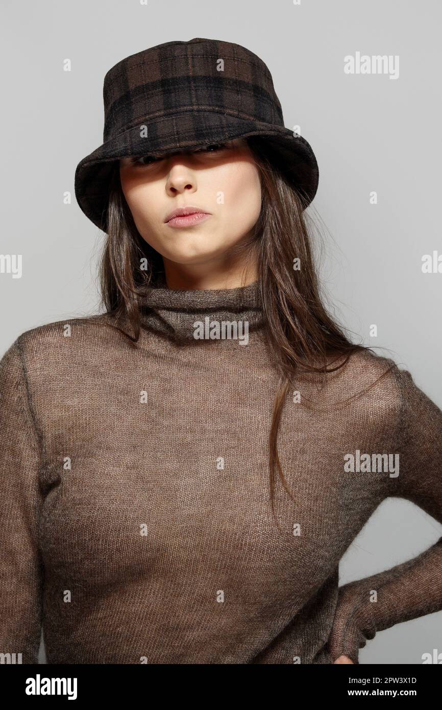 Portrait of beautiful girl in angora sweater and plaid wool hat Stock ...