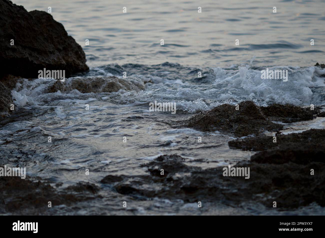 Sea waves crashing into rocks. Storm at the sea, dark, moody photo ...