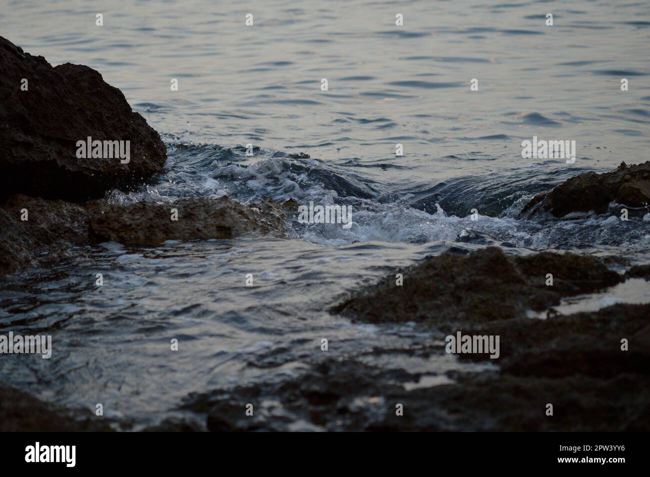 Sea waves crashing into rocks. Storm at the sea, dark, moody photo ...