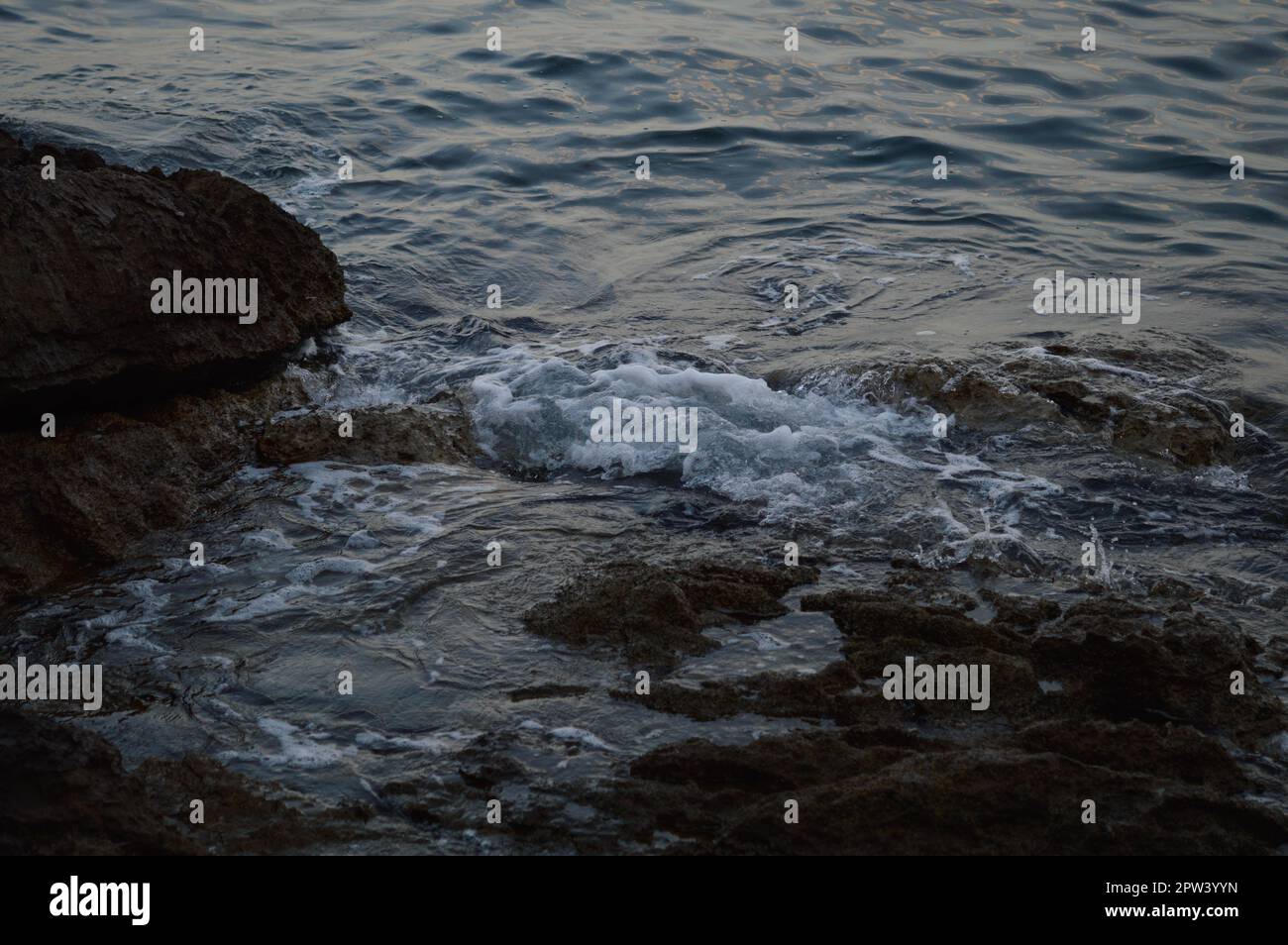 Sea waves crashing into rocks. Storm at the sea, dark, moody photo ...