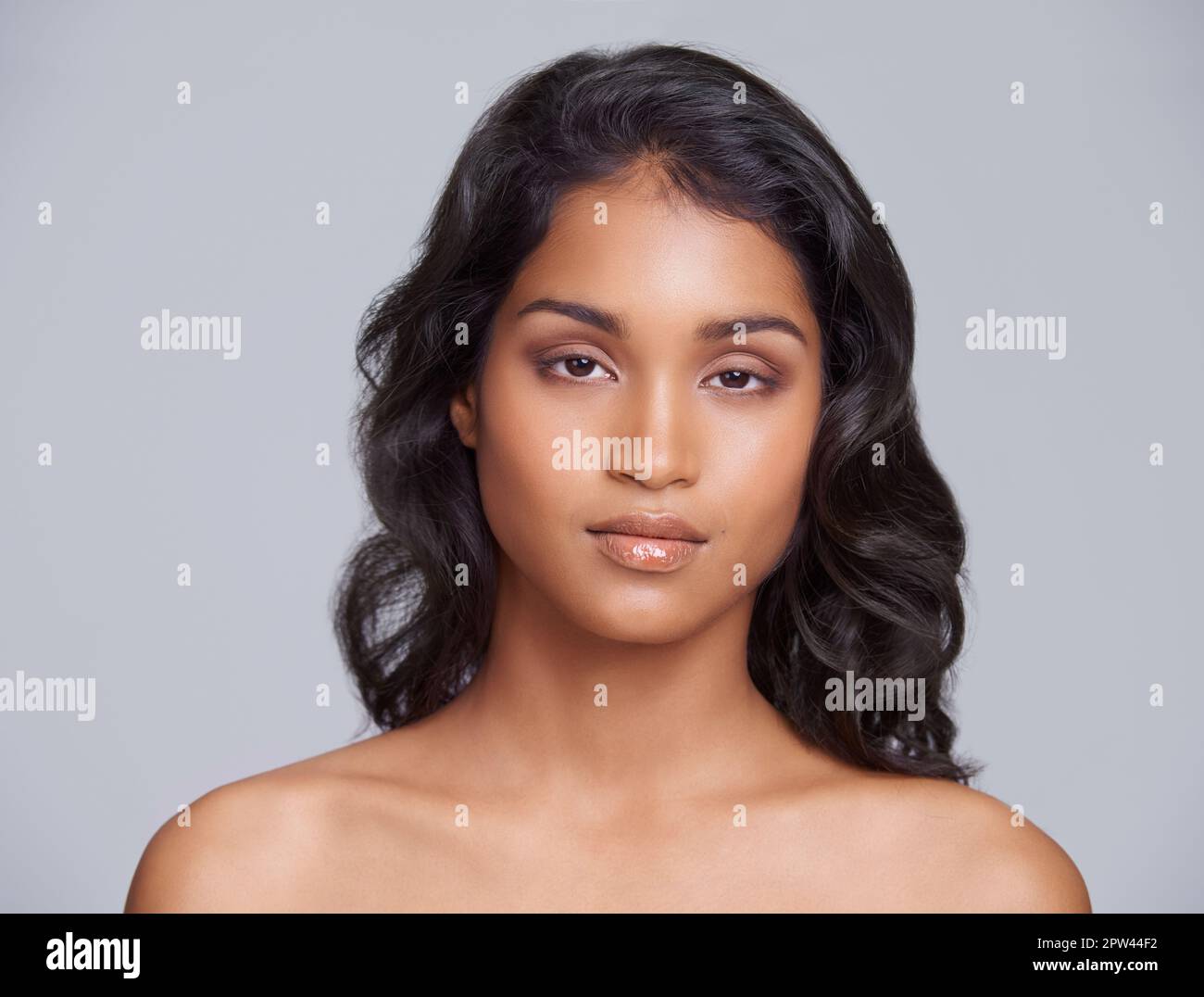 The most perfect complexion. a beautiful young posing over a gray ...