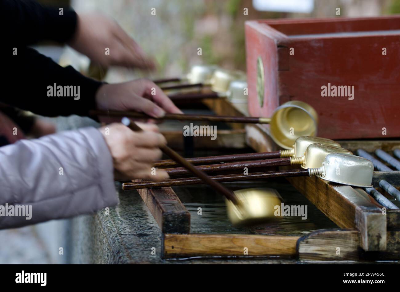 People performing ablutions, ceremonial purification rite known as ...