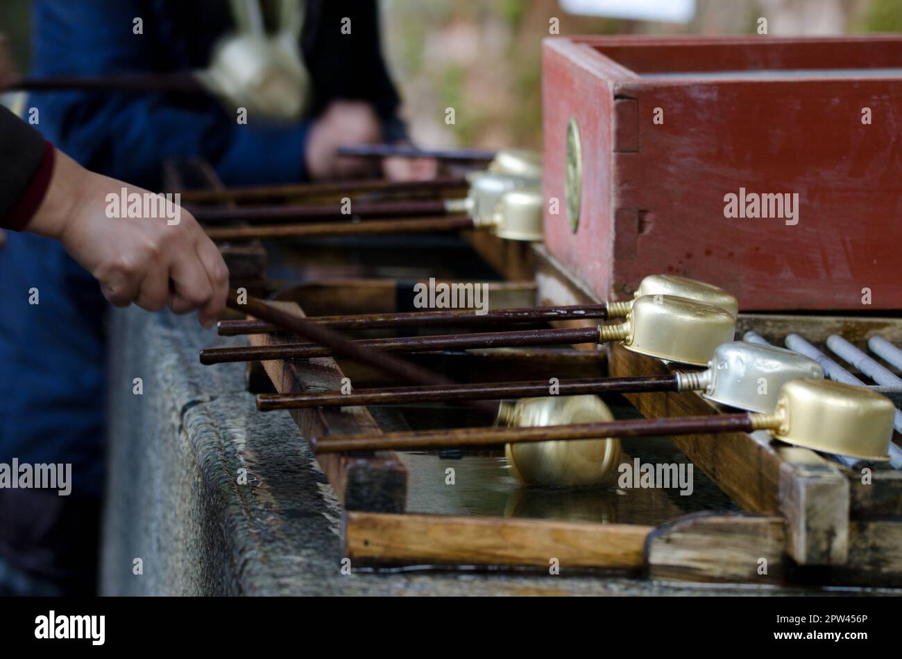 People performing ablutions, ceremonial purification rite known as ...