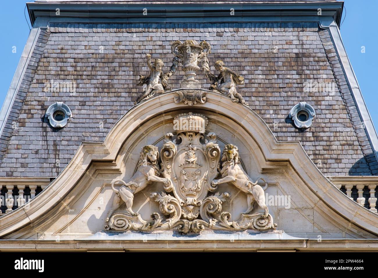 Rampant lions hold up the coat of arms of Festetics family on the tower ...
