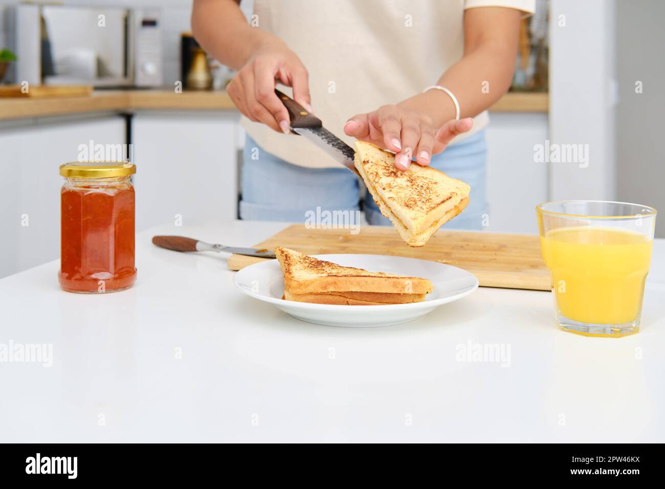 Female hands put toasted bread hi-res stock photography and images - Alamy