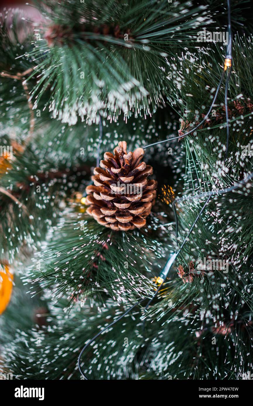 Christmas tree with pinecone as a decoration Stock Photo - Alamy