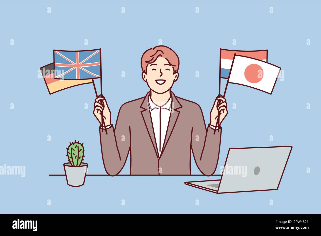 Satisfied man sits at table with laptop and shows flags of different ...