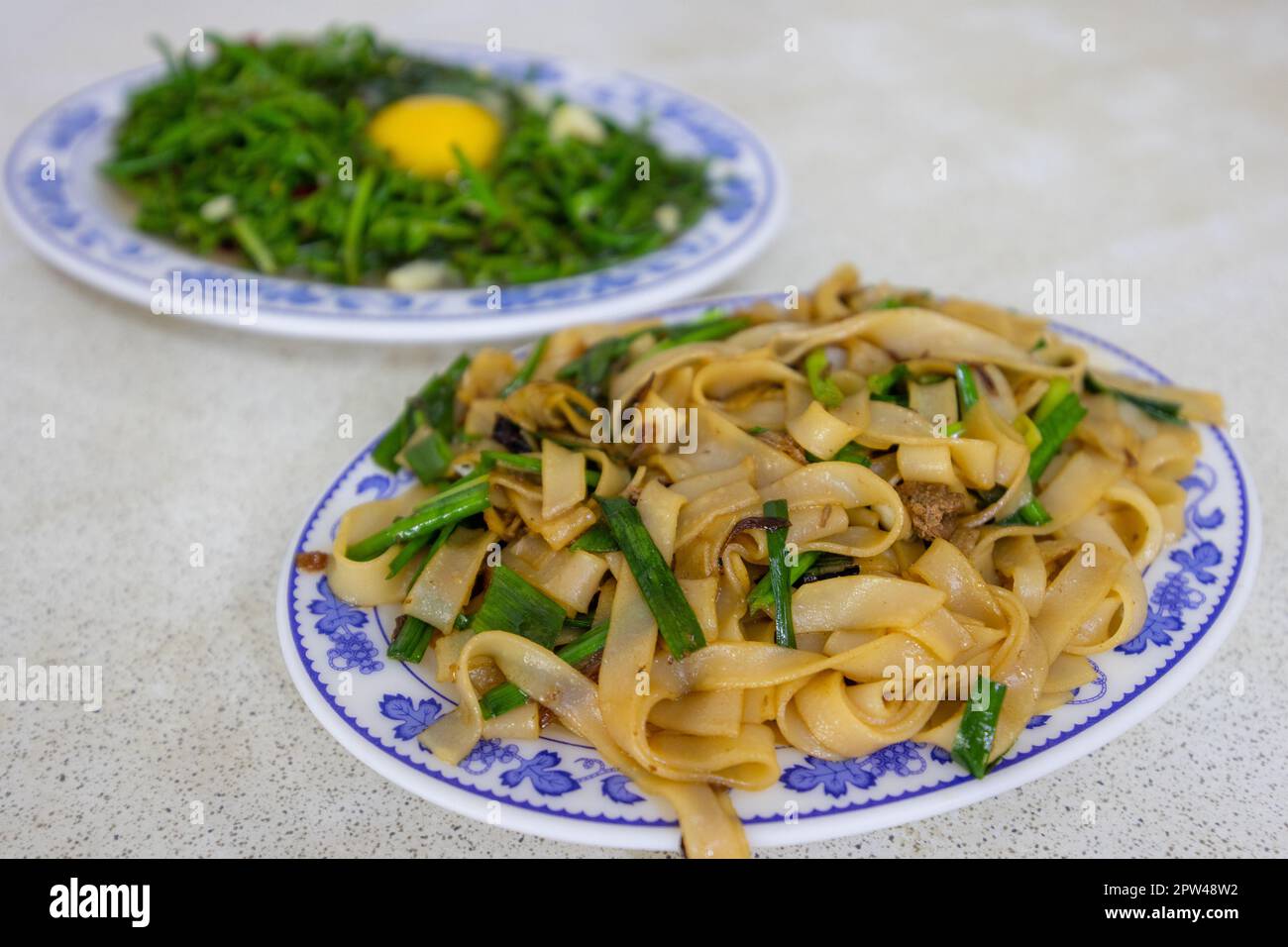 Taiwanese local food with fry vegetable and flat rice noodle Stock ...