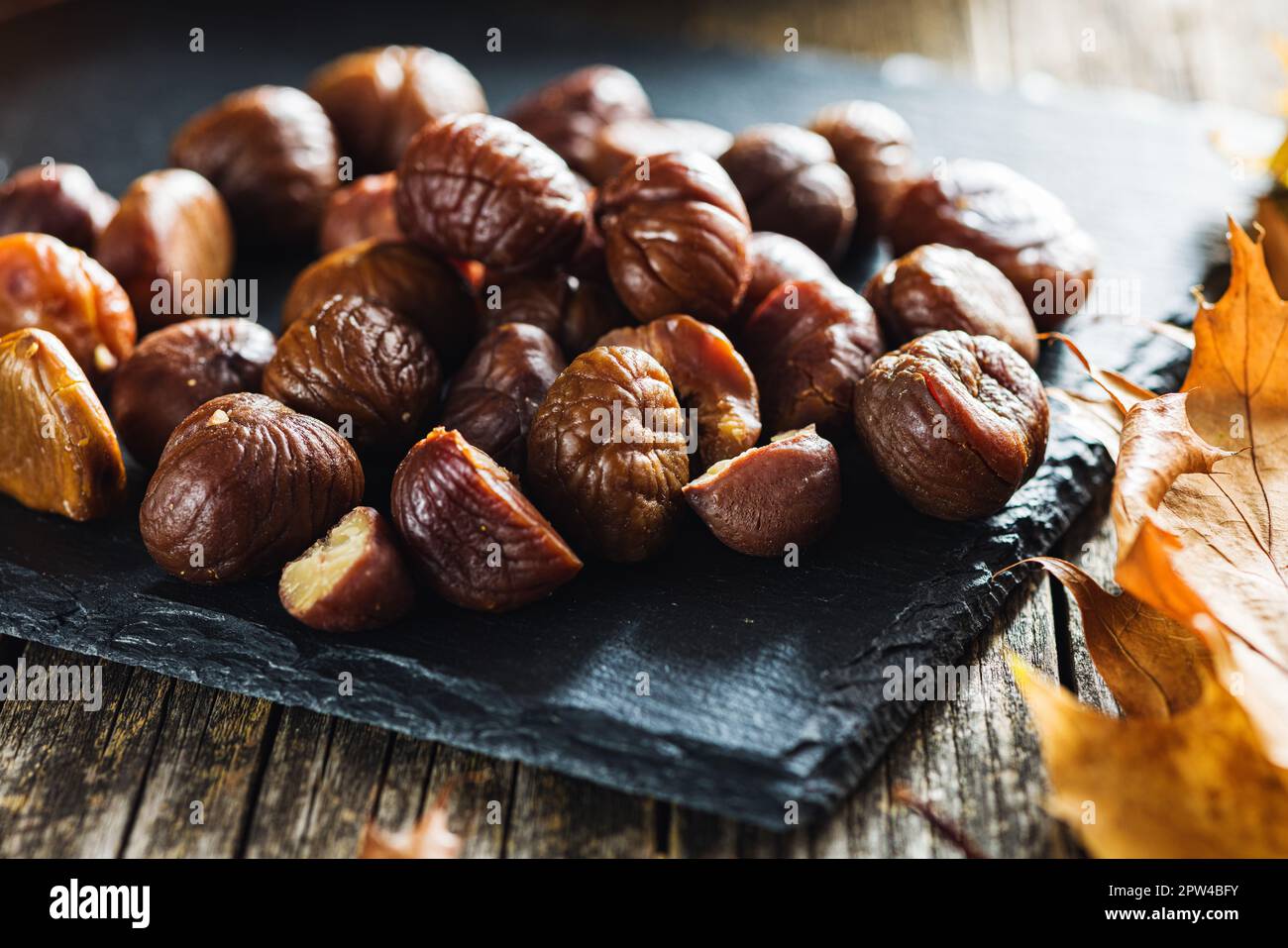 Peeled chestnuts. Sweet roasted chestnuts on the cutting board Stock ...