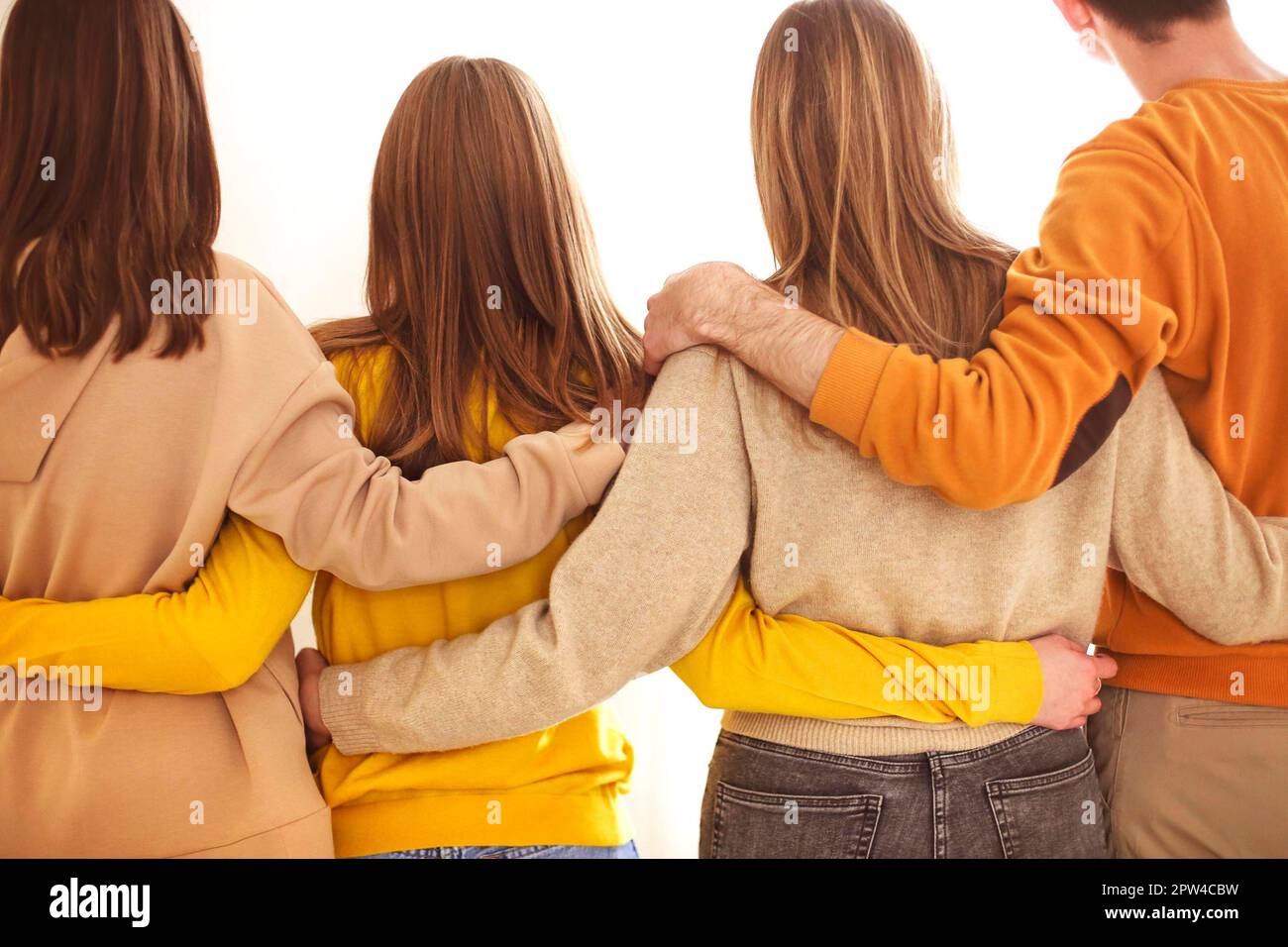 Back view of anonymous man and women embracing each other while ...