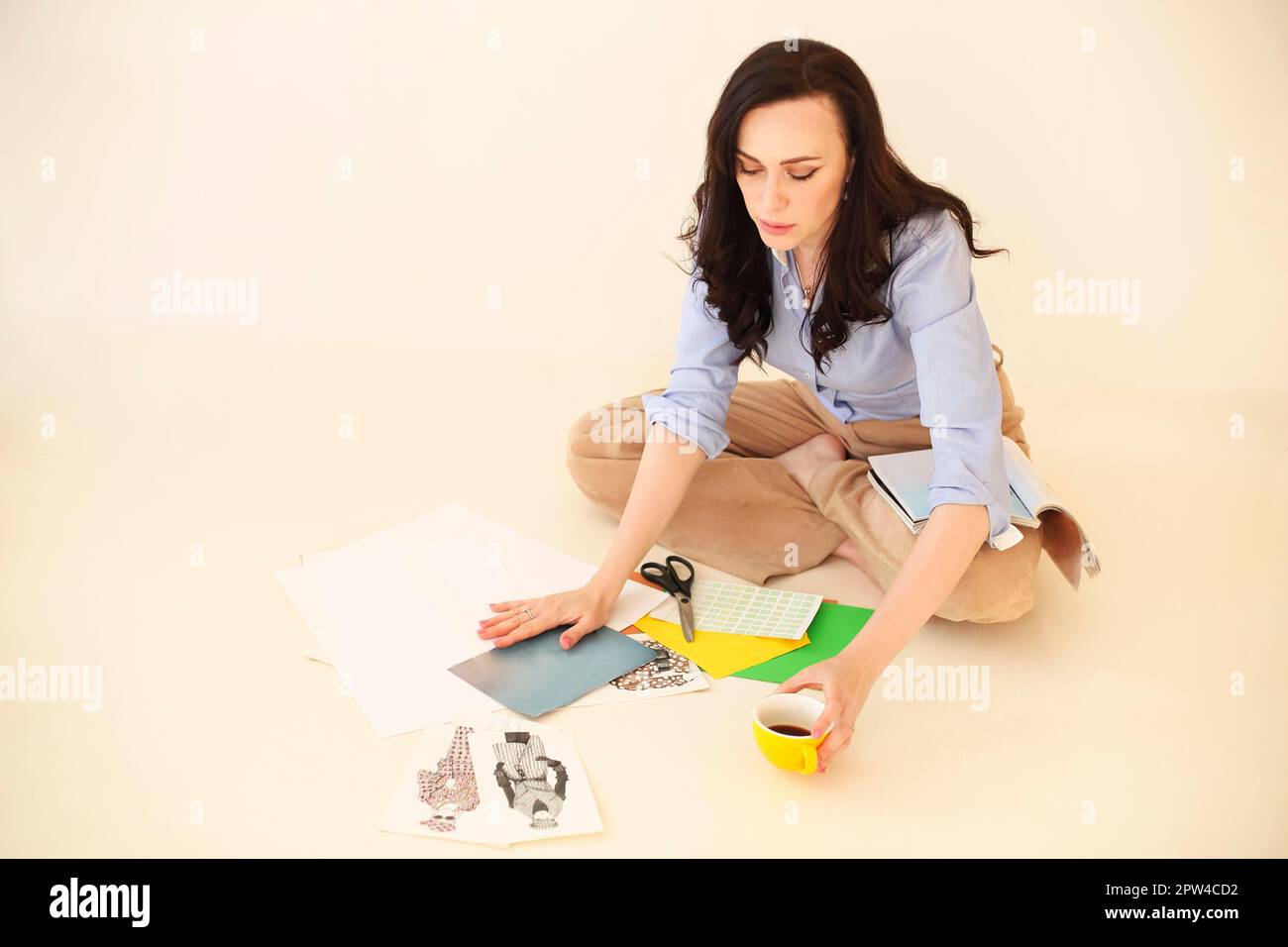 Young brunette woman creating her Feng Shui wish map. Dreams and wishes ...