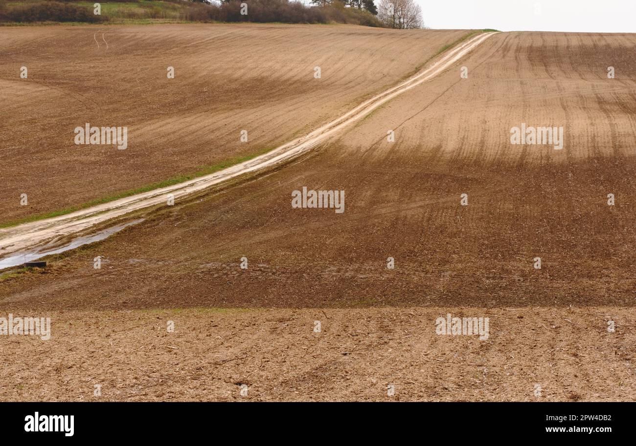 Agricultural farm field of ploughed soil. Landscape with brown ground ...