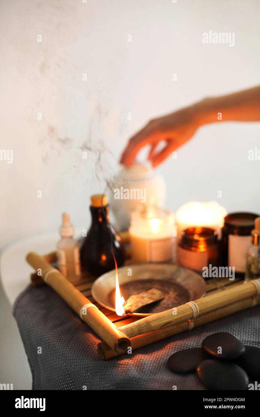 From above of aromatherapy candles and assorted skincare products ...